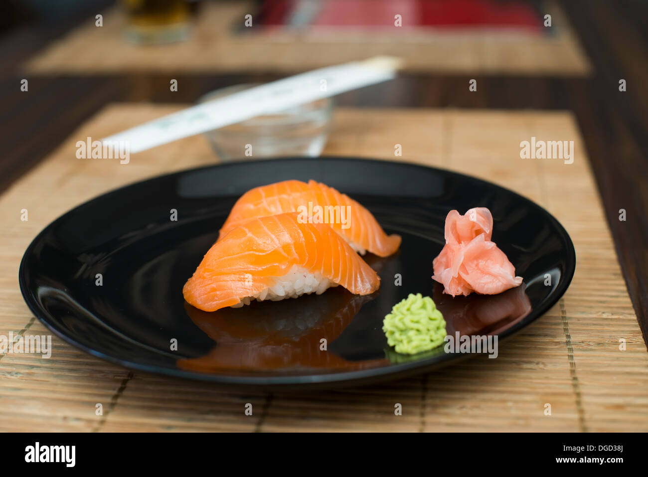 Sushi in sushi bar. Table and ration sushi with salmon Stock Photo - Alamy