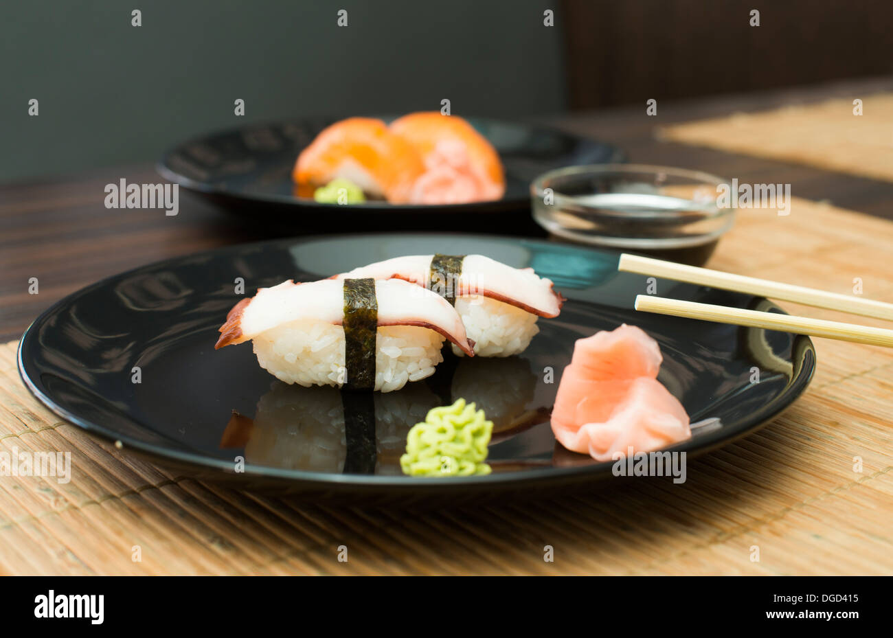 Sushi in sushi bar. Table and ration sushi Stock Photo - Alamy