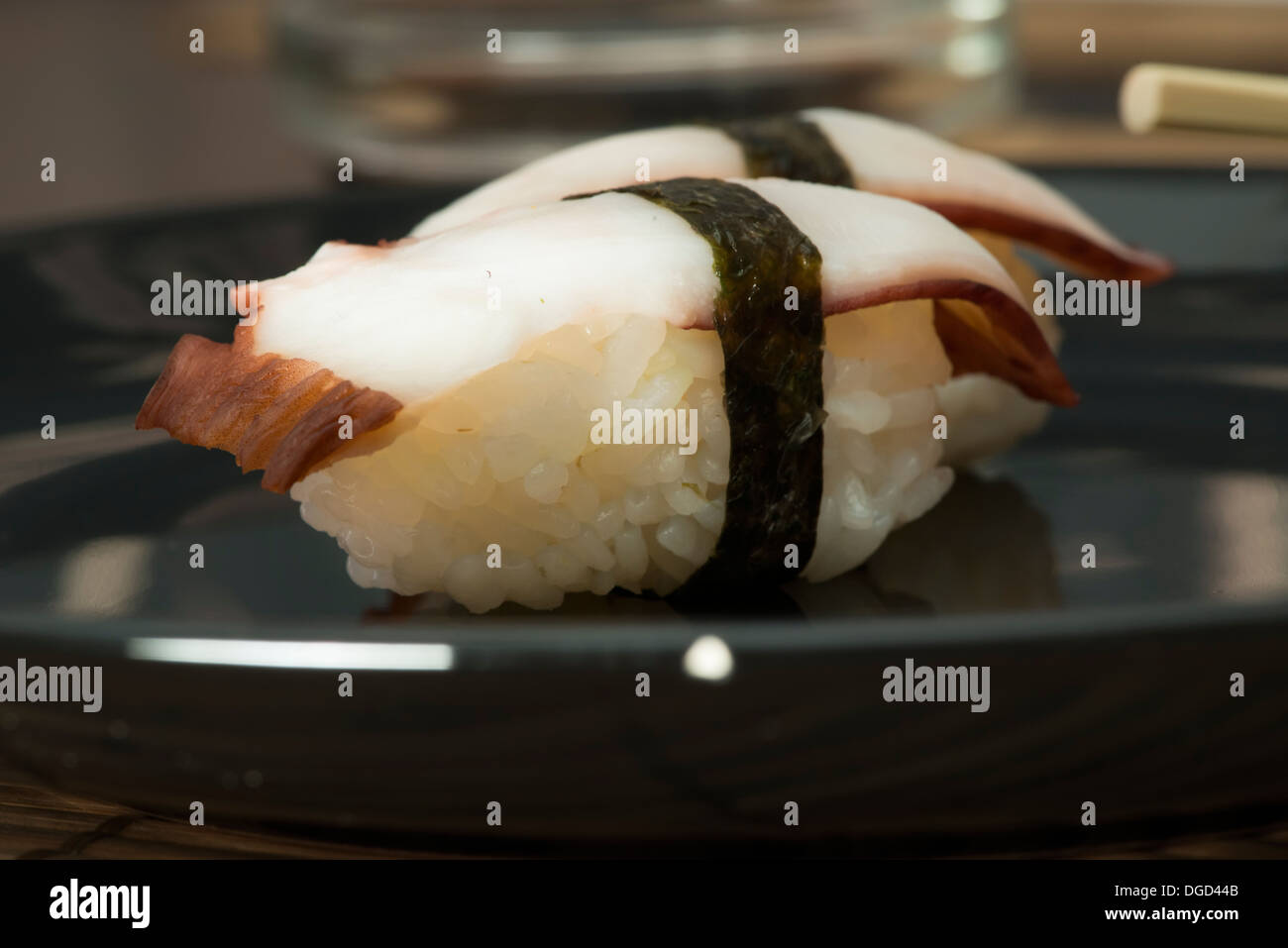 Sushi in sushi bar. Table and ration sushi Stock Photo - Alamy