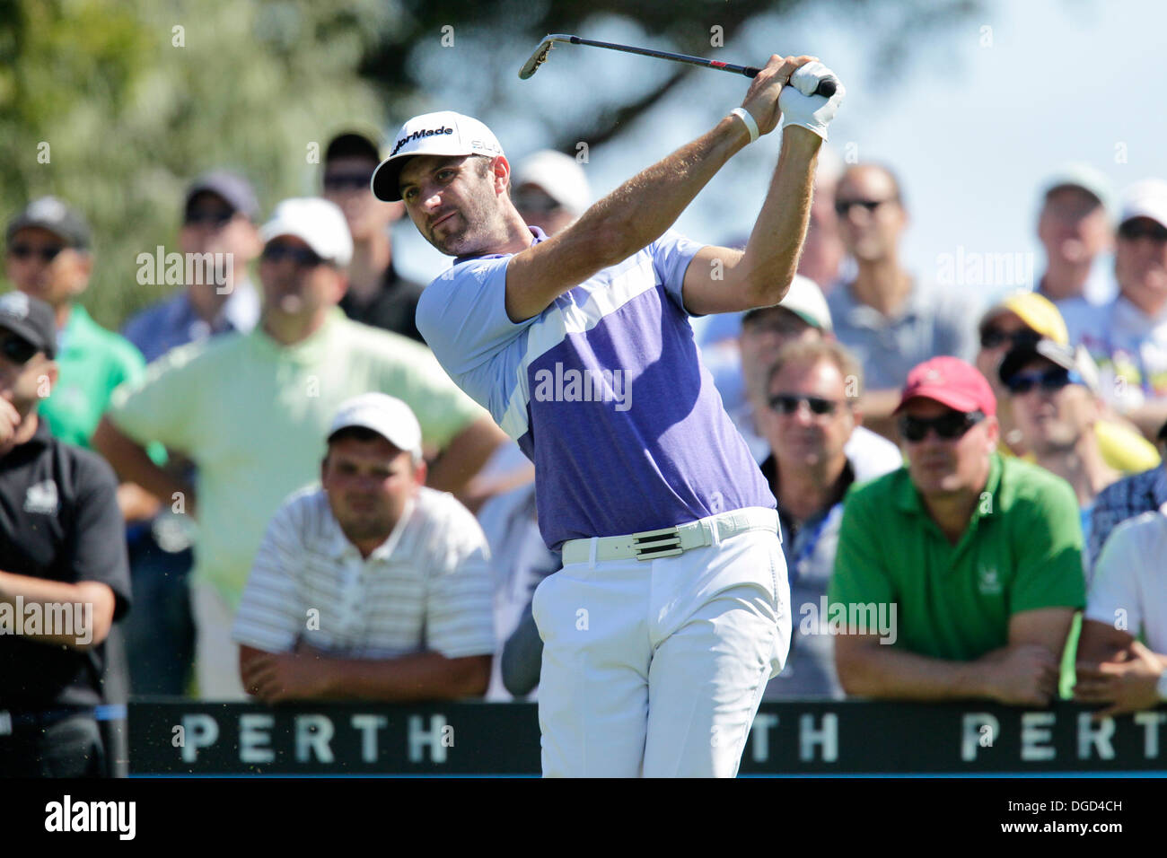 Perth, Australia. 18th Oct, 2013. Dustin Johnson (USA) drives from the ...