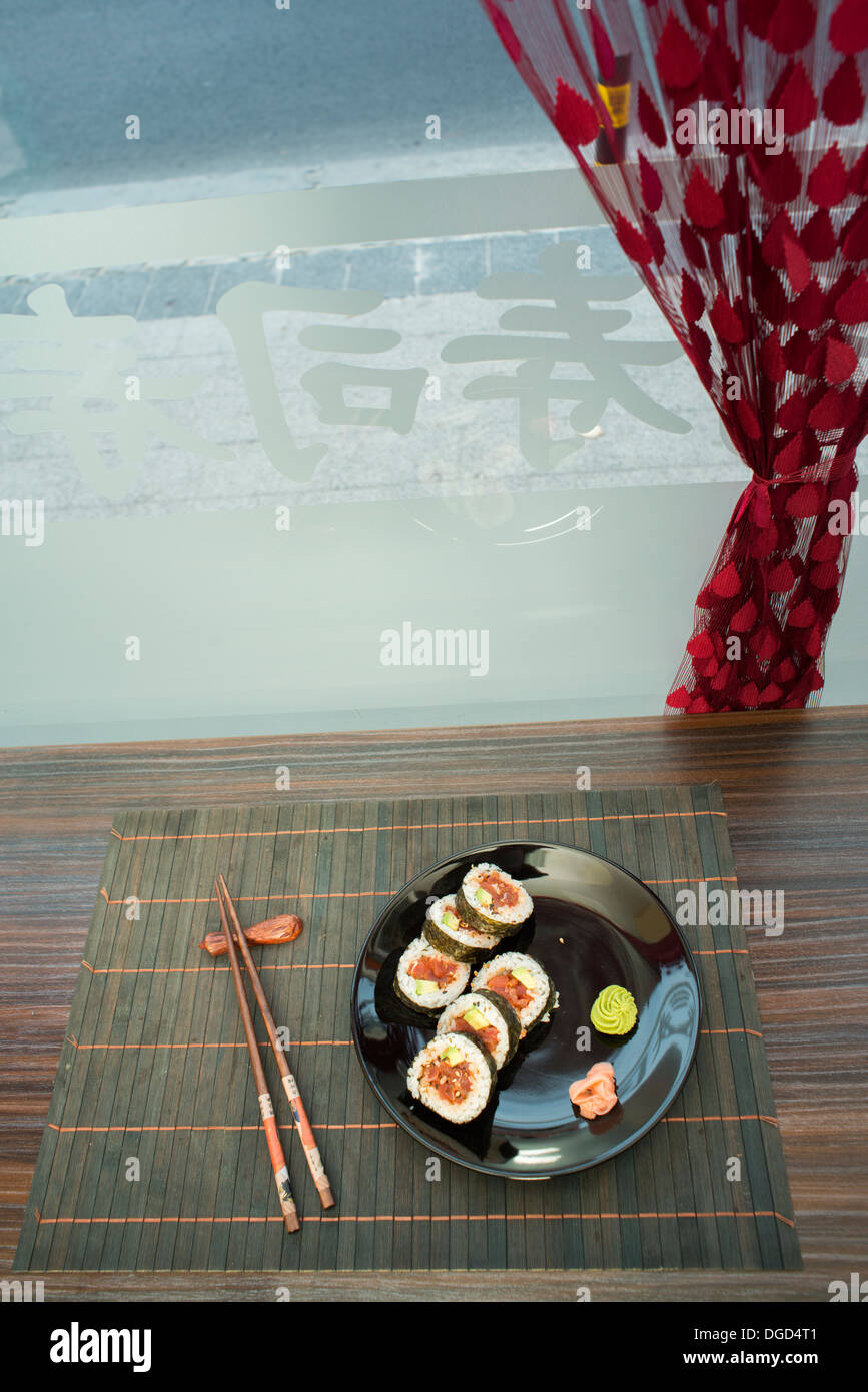 Sushi in sushi bar. Table and ration sushi Stock Photo - Alamy