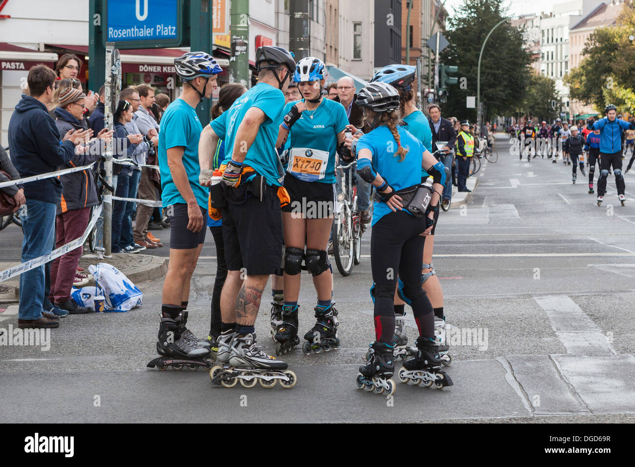 Skaters stop to discuss strategy during In-line skating, rollerboarding ...