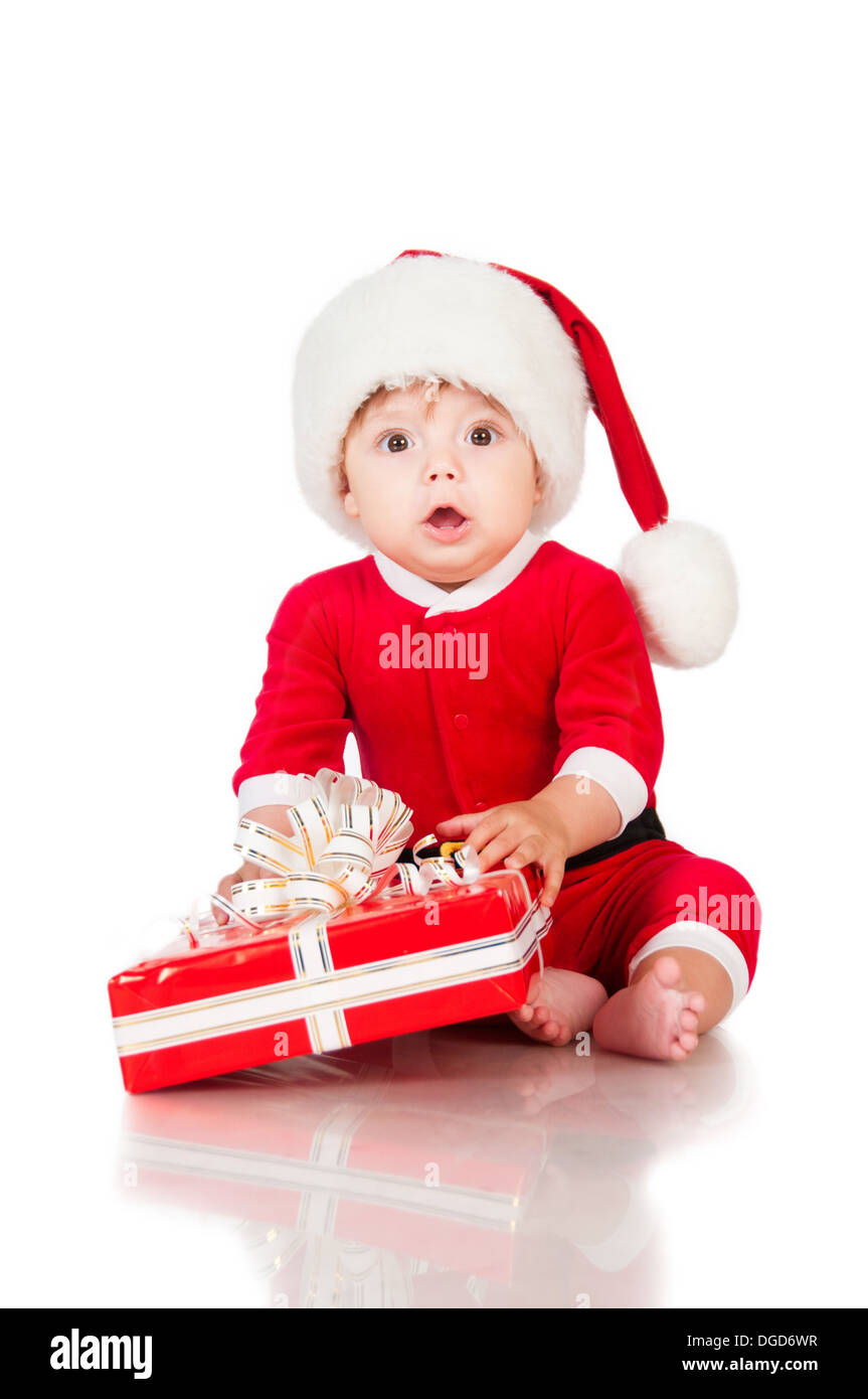 Thoughtful little Santa Claus with presents. Isolated on white ...