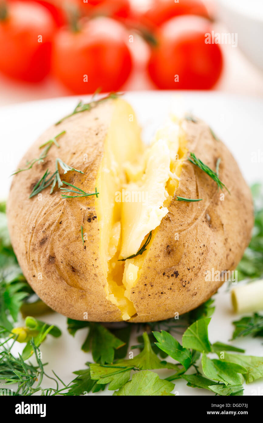 Baked potato with butter Stock Photo - Alamy