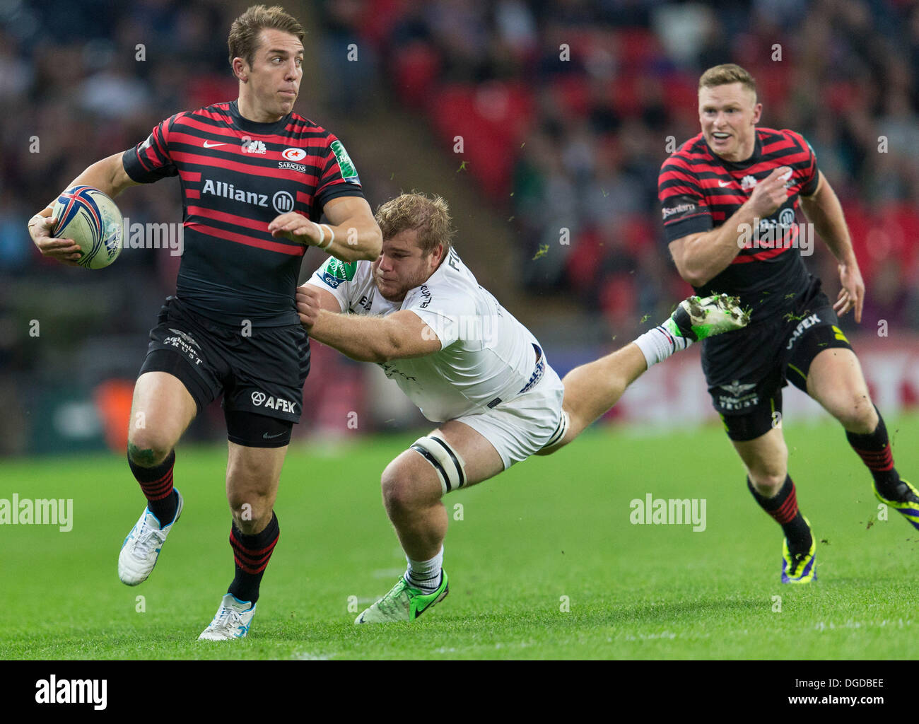 London, UK. 18th Oct, 2013. Chris WYLES of Saracens beats the cover ...