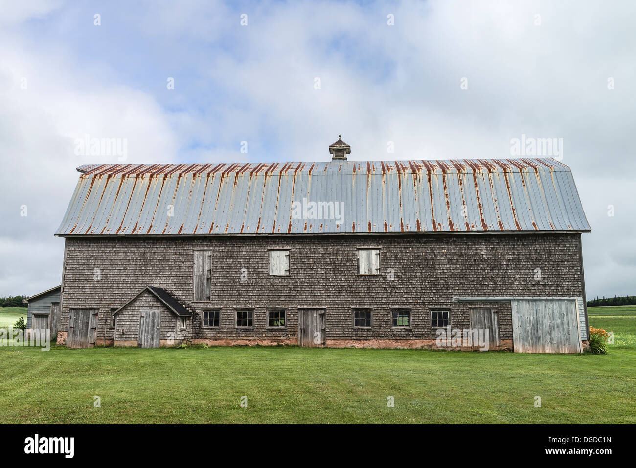Old weathered shake shingle sided barn with rusted metal roof Prince ...