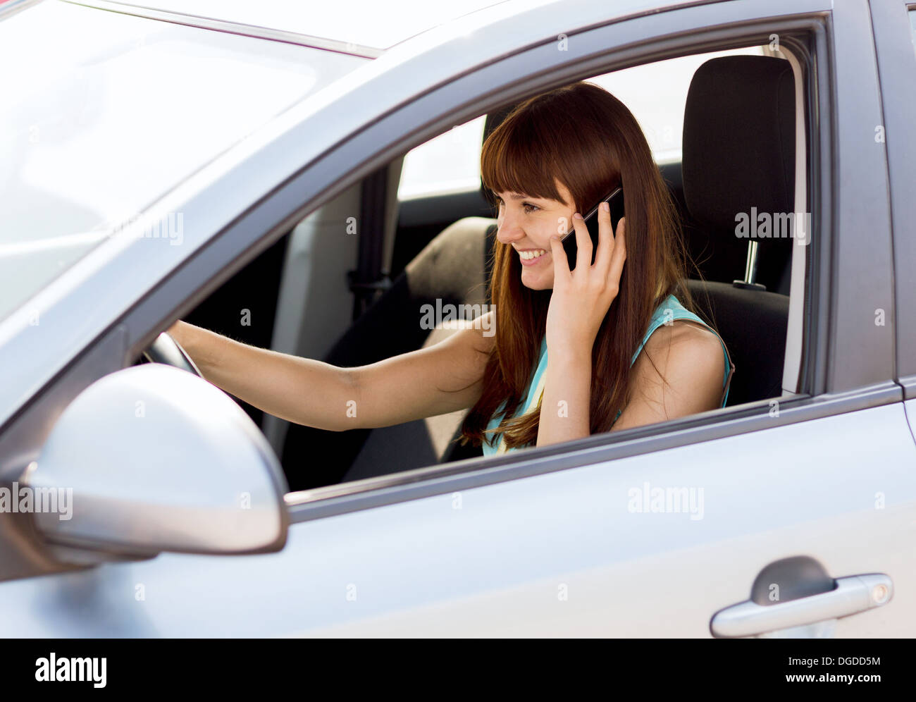 woman using phone while driving the car Stock Photo - Alamy