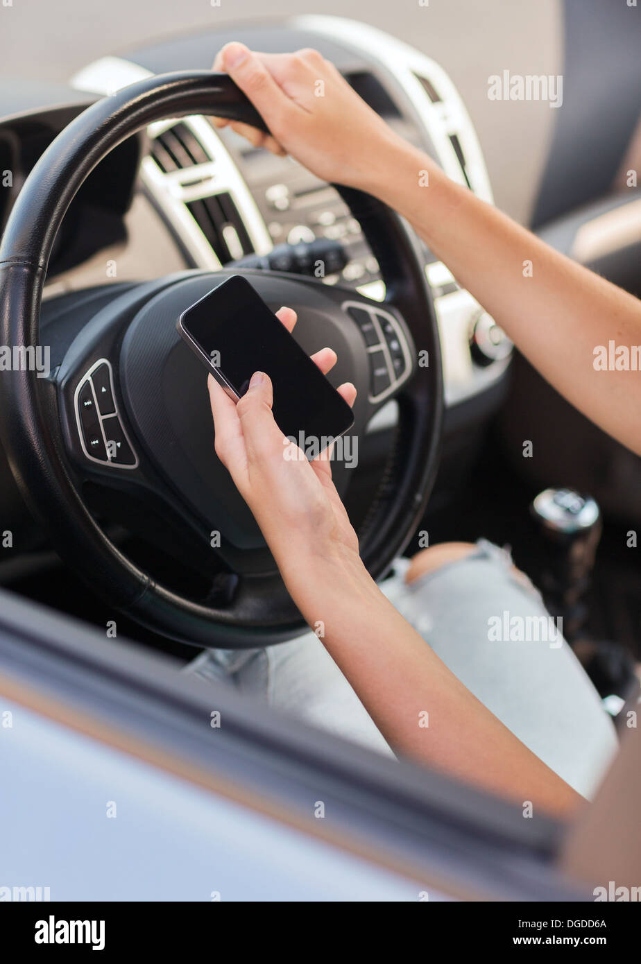 woman using phone while driving the car Stock Photo - Alamy