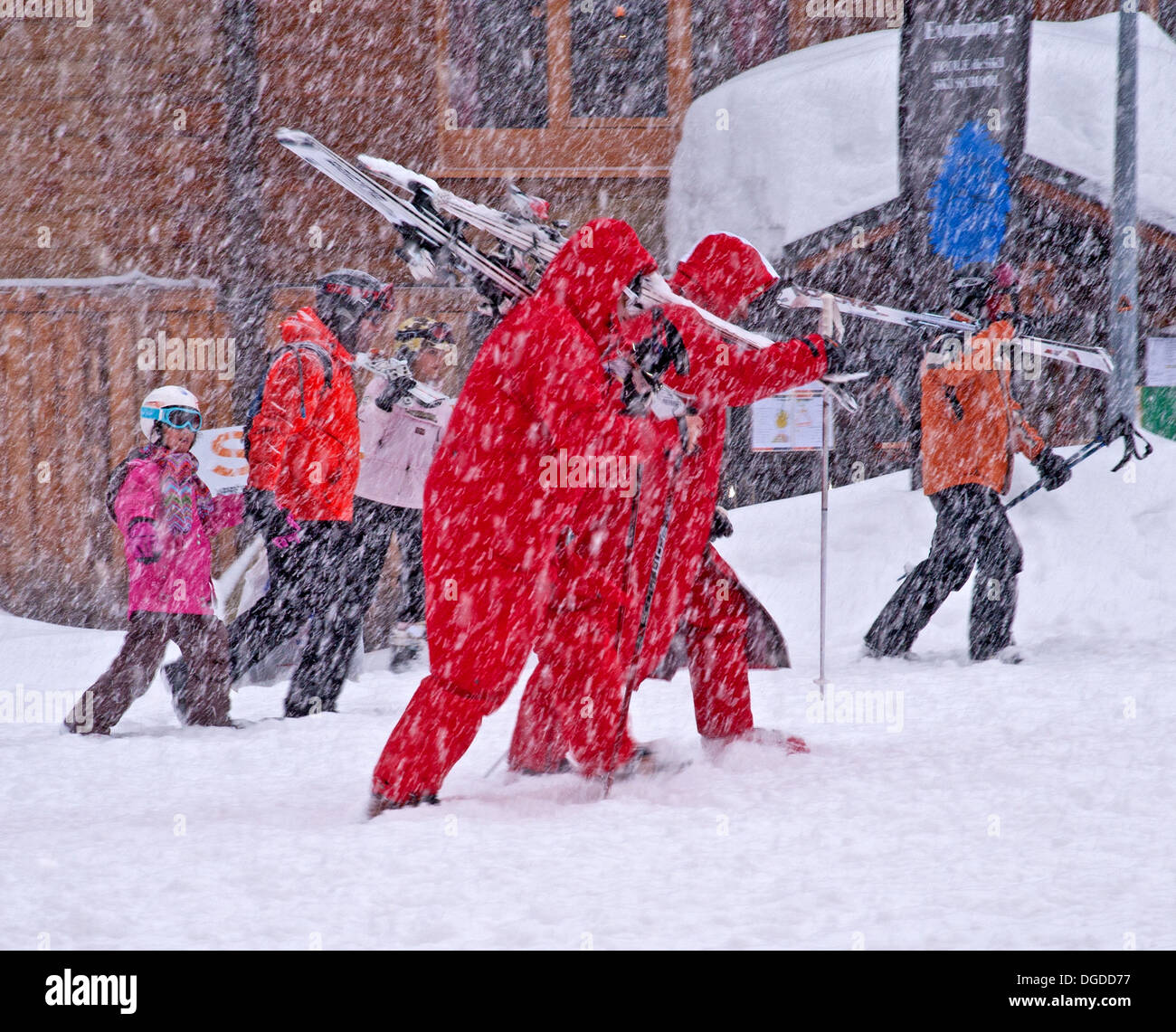 Skiers walking in snow in a blizzard Stock Photo - Alamy