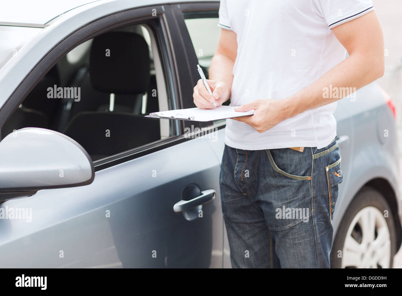 man with car documents Stock Photo - Alamy
