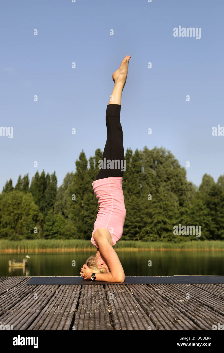 Woman park in headstand hi-res stock photography and images - Alamy