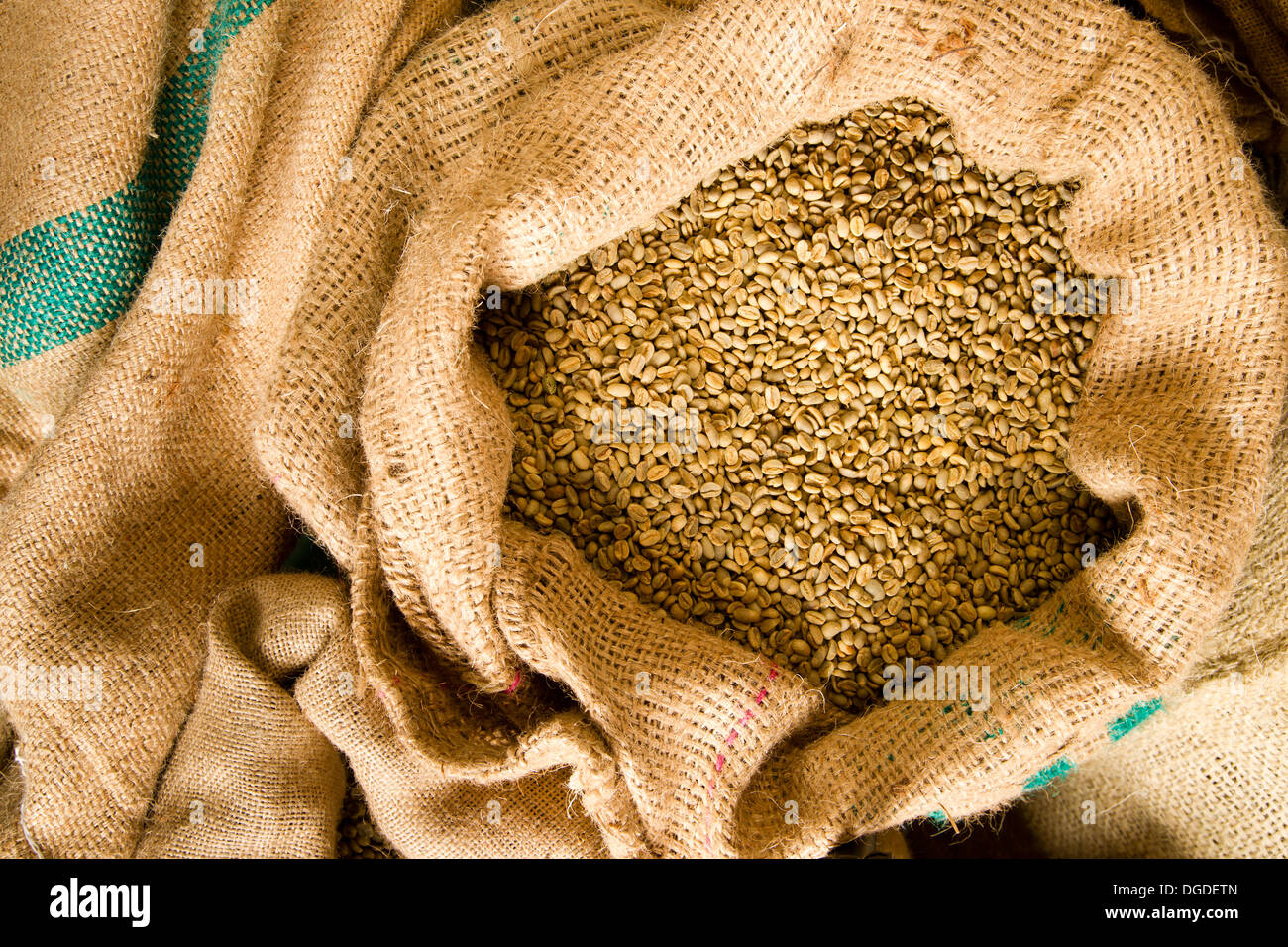 Big sack of coffee beans waiting to be roasted in coffee roaster ...