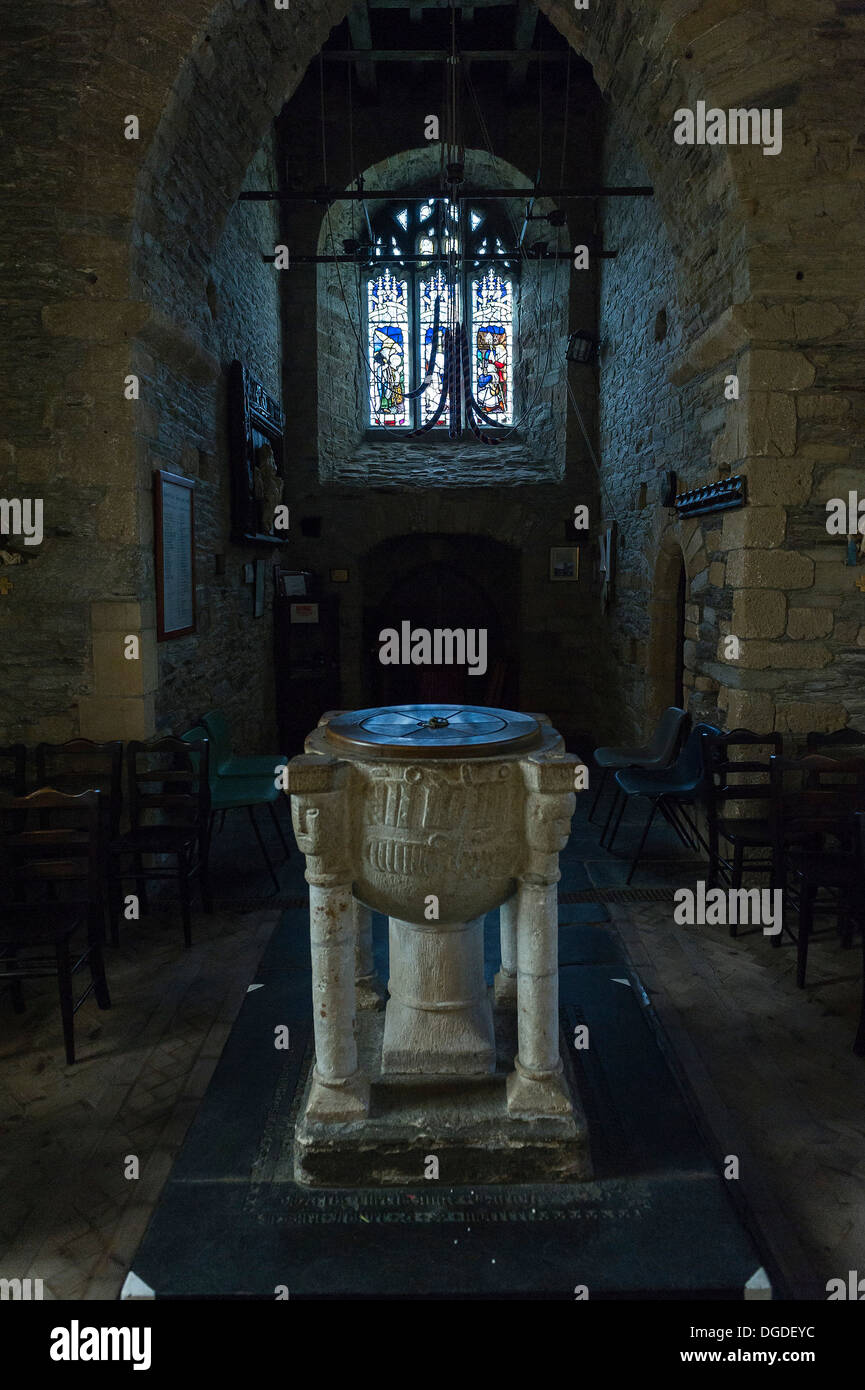 The 12th Century font in St Carantoc's Church Stock Photo - Alamy