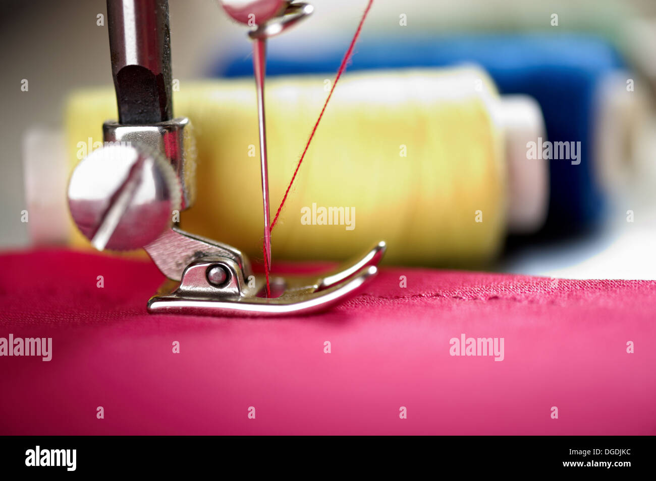 Close up of threads on fabric and sewing machine. Shalow DOF. Selective ...