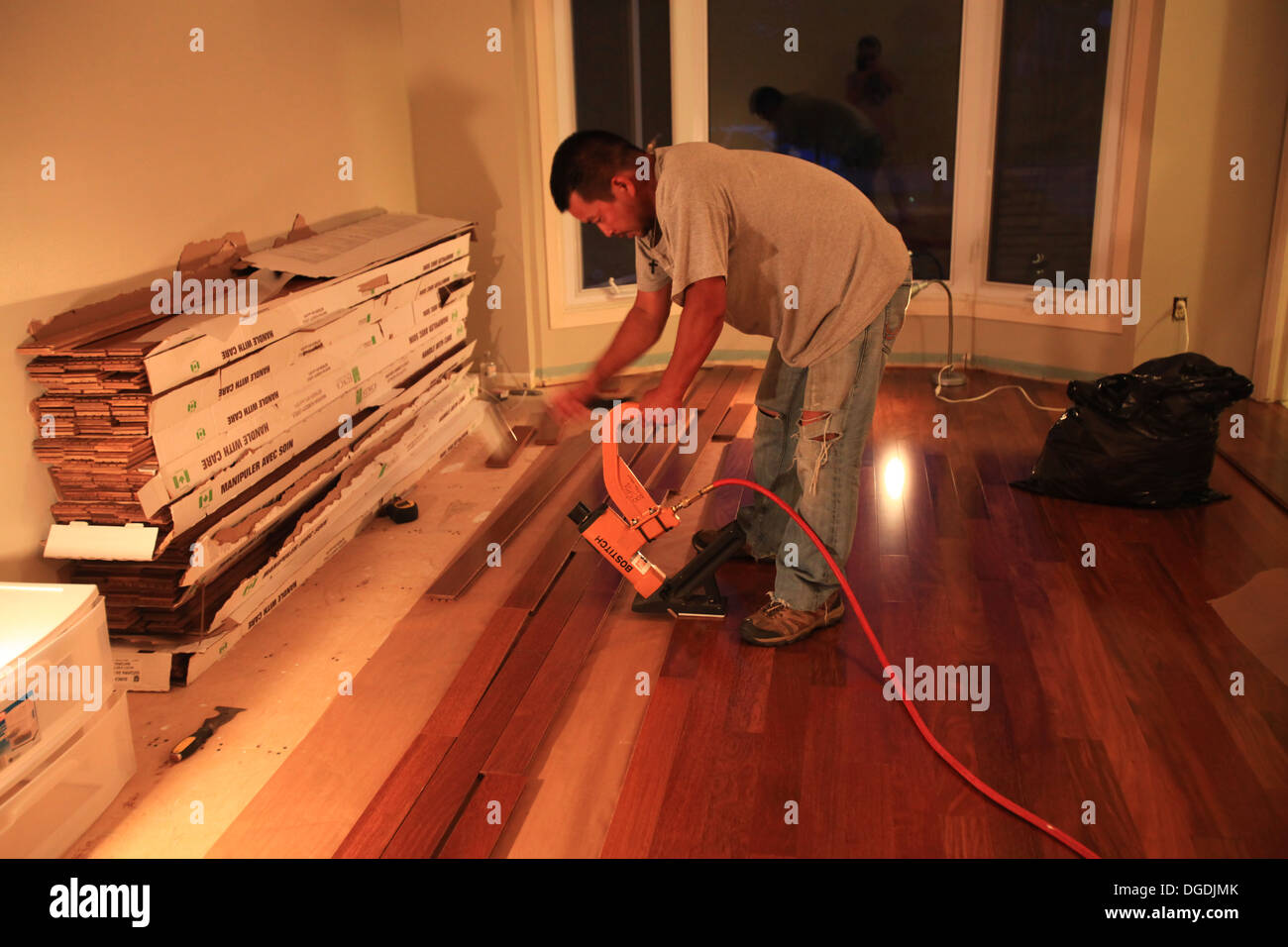 Solid hardwood floor installation Stock Photo - Alamy