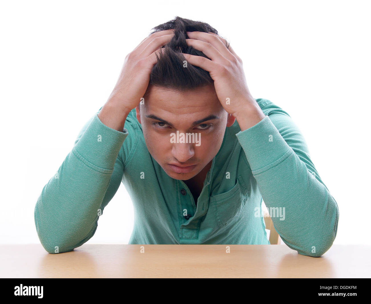 young man with head in hands Stock Photo - Alamy