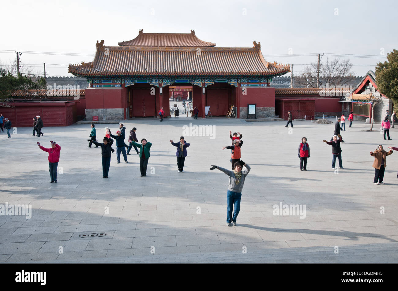Morning exercises in Jingshan Park in Beijing, China. Behind the group ...