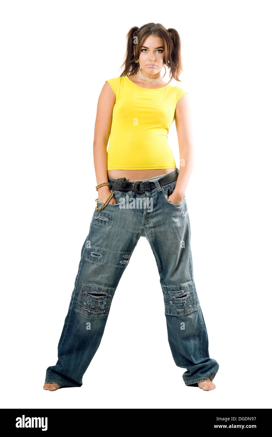 Young rapper girl in wide jeans and yellow top. Isolated Stock Photo ...