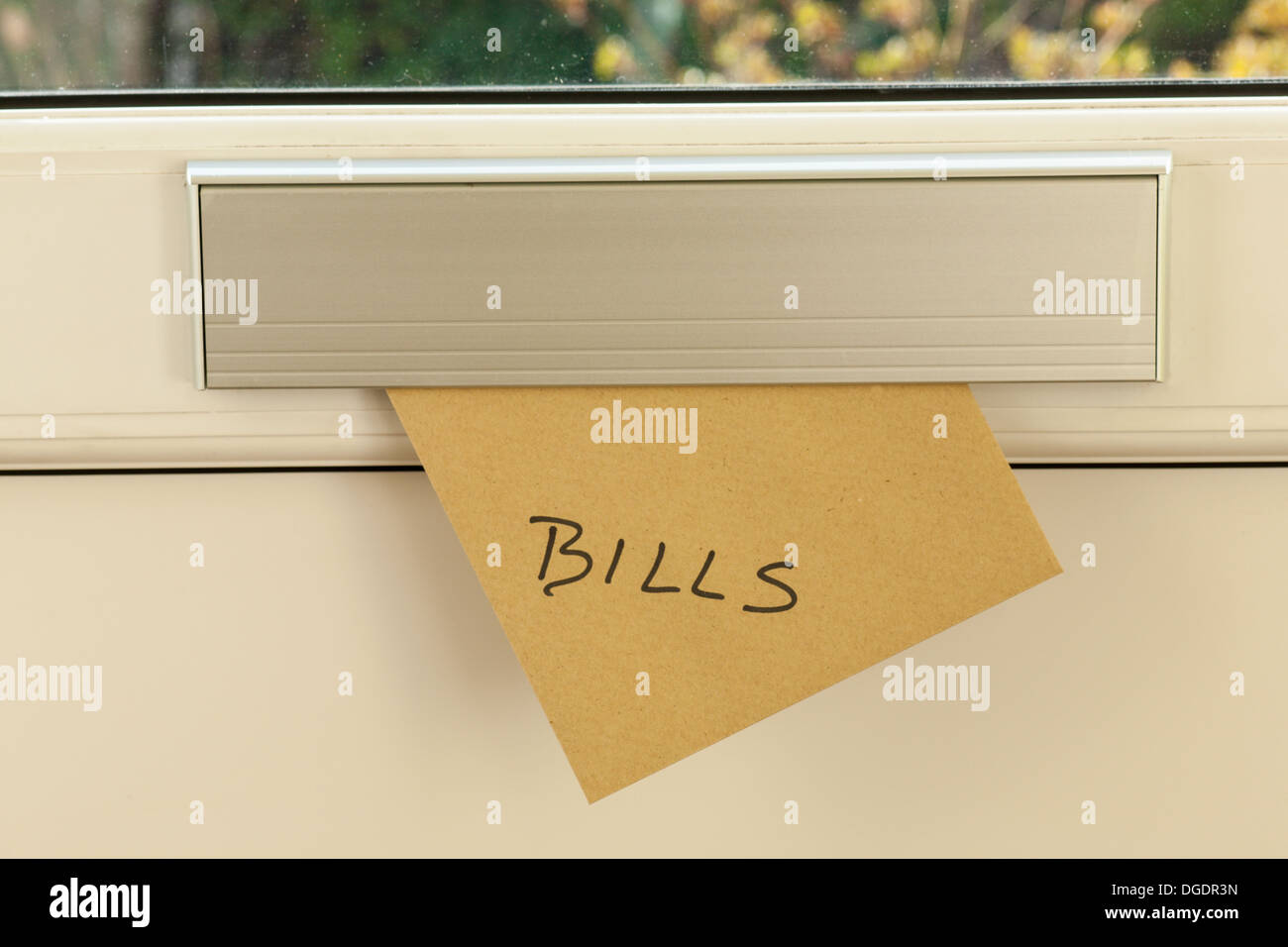 Bill posted through house letter box Stock Photo - Alamy