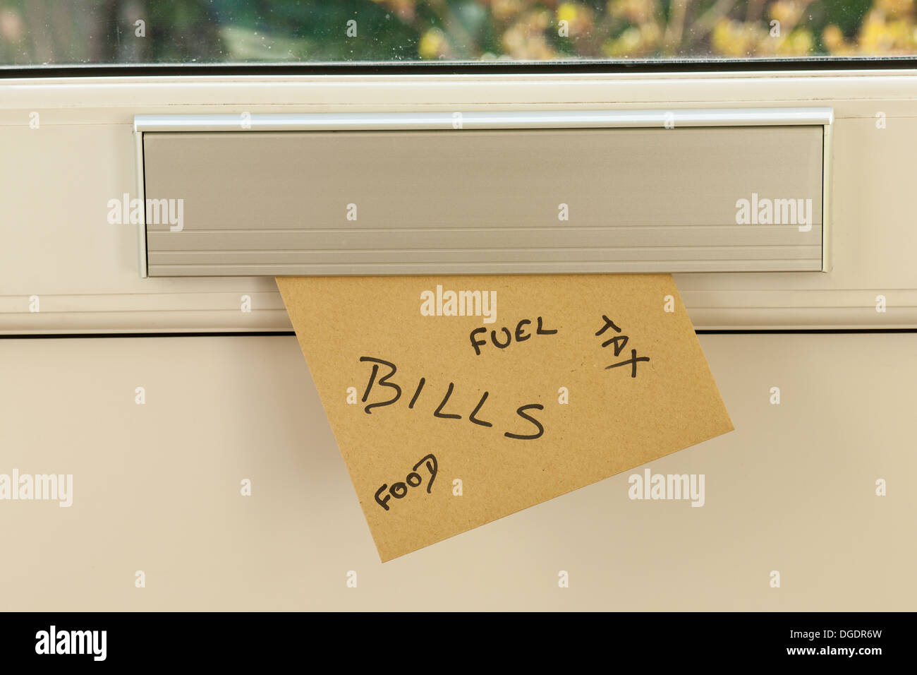 Bill posted through house letter box Stock Photo - Alamy