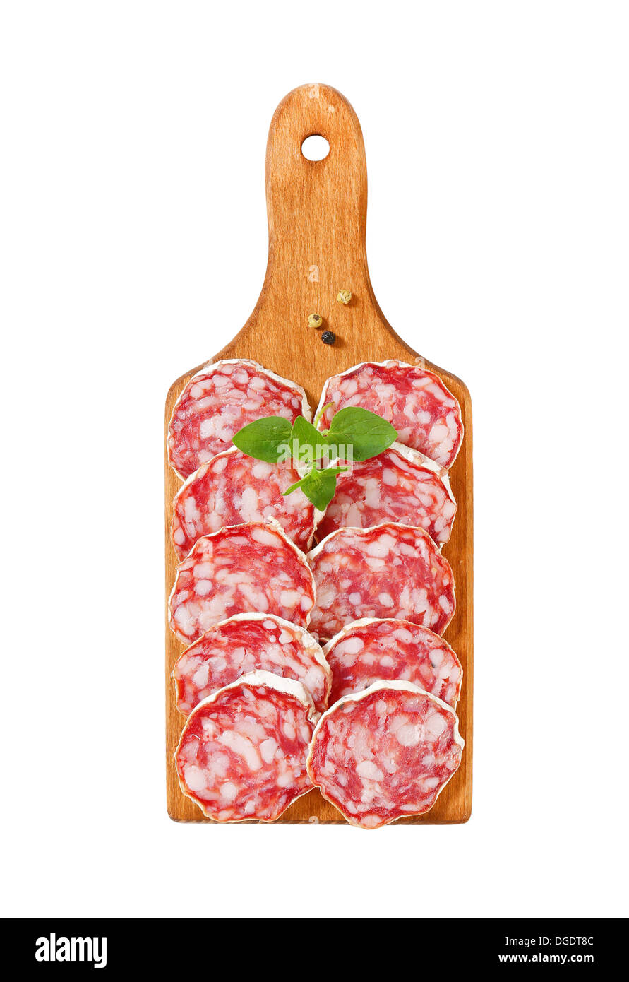 Sliced French Saucisson Sec on cutting board Stock Photo - Alamy
