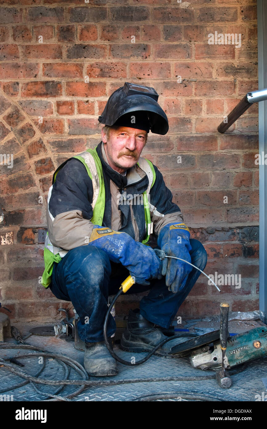 Andrew Brown, blacksmith, working on the new stairwell at the rear of ...