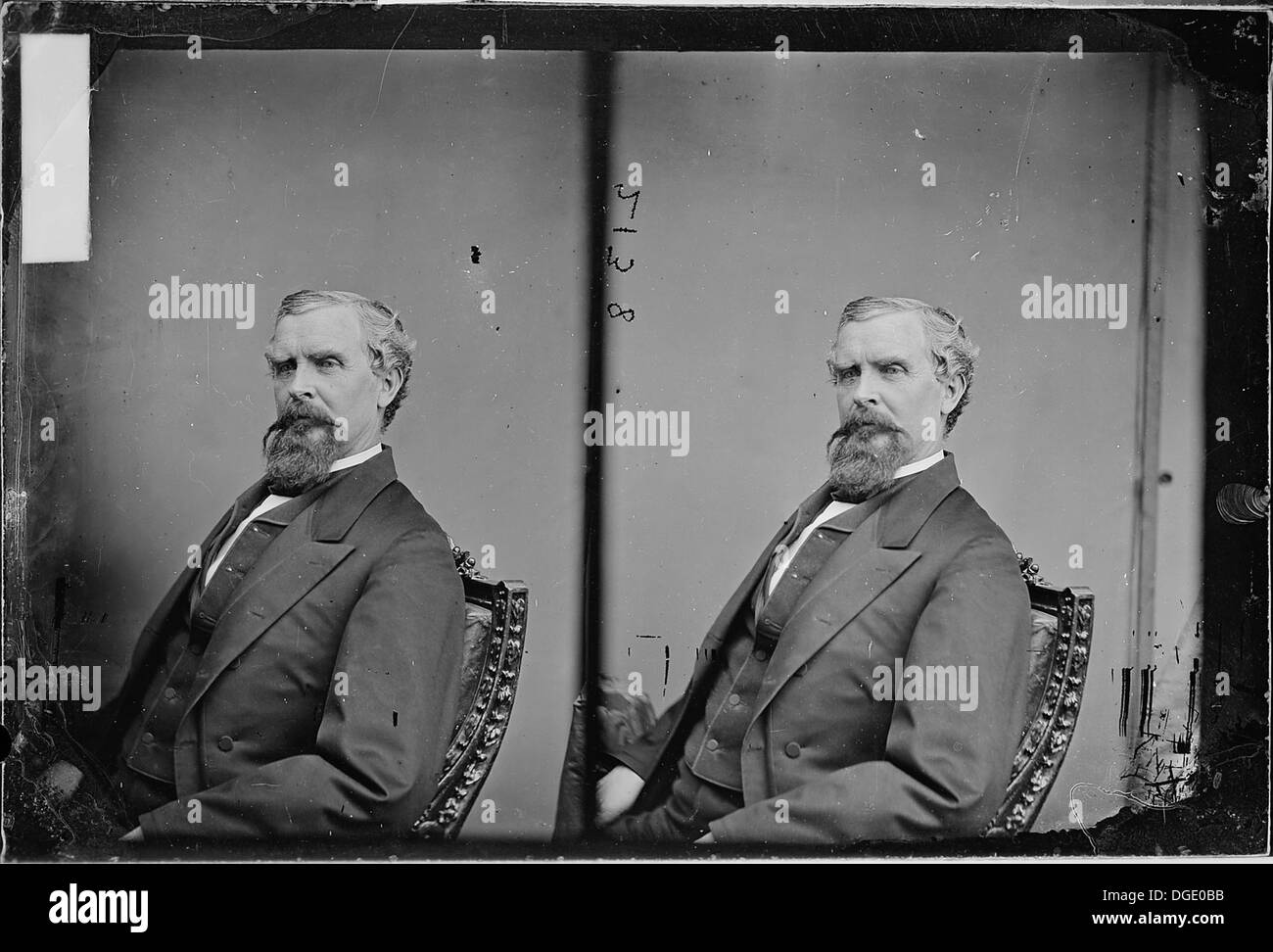 A well-dressed gentleman poses for a portrait, capturing a moment of ...