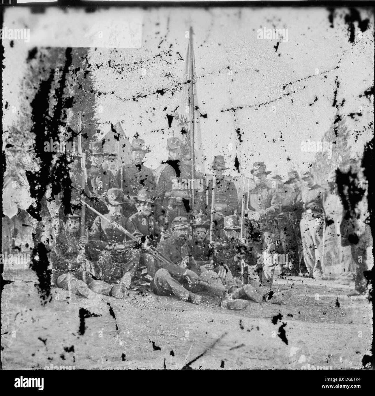 A group of soldiers is shown in a photograph, likely from a military ...