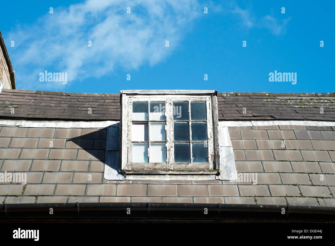 Old dormer window set into tiled roof Stock Photo - Alamy