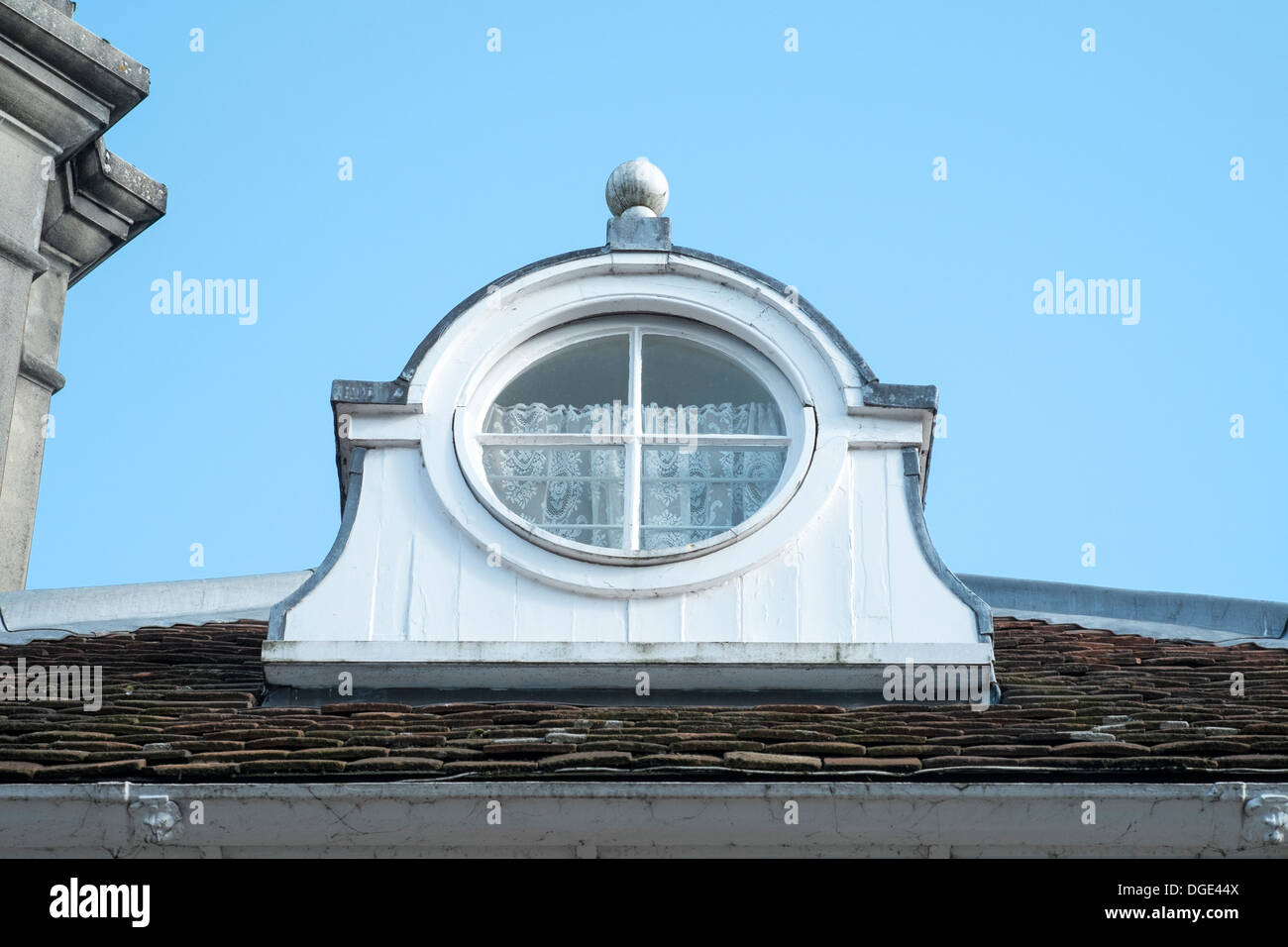 Looking up at circular dormer window Stock Photo - Alamy