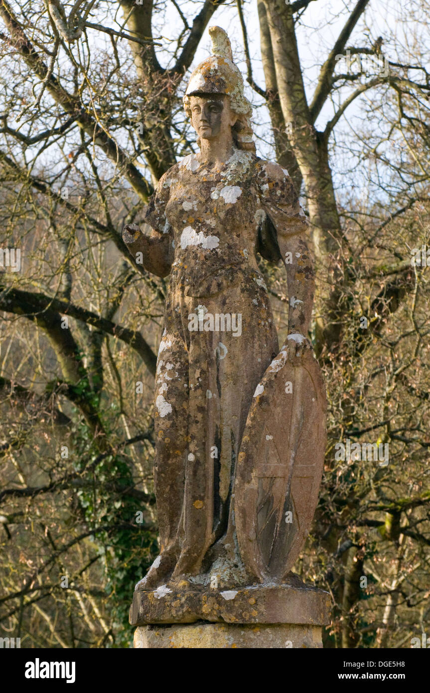 Statue at Iford Manor standing on the bridge straddling the River Frome ...