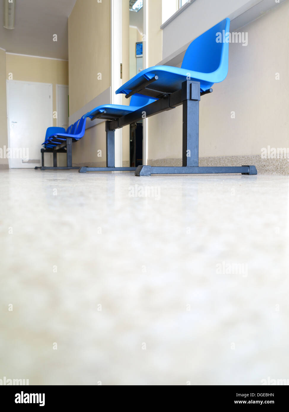 Interior of a waiting room blue stools, empty chairs Stock Photo - Alamy
