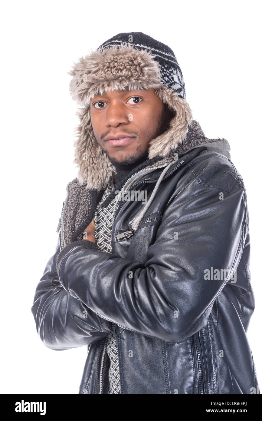 Young African-American wearing winter clothing but feeling cold in a ...