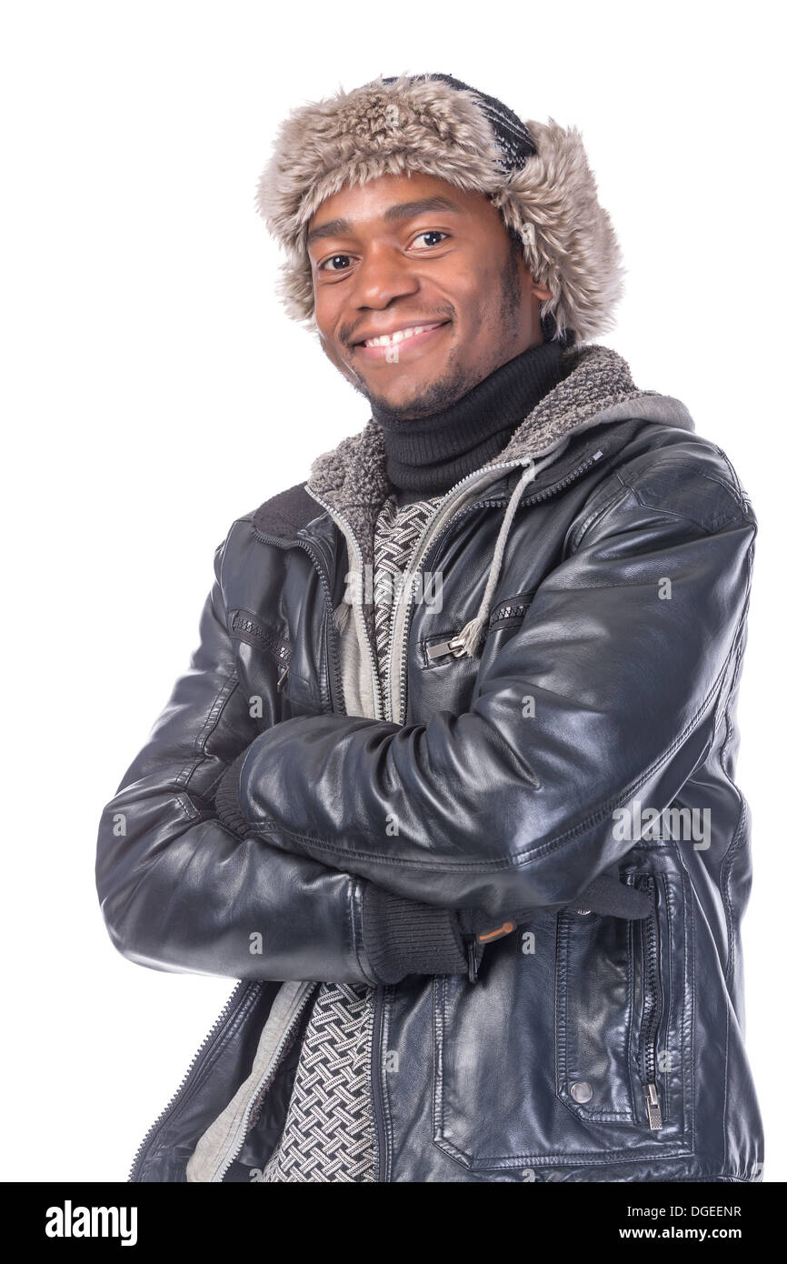 Young African-American wearing winter clothing but feeling cold in a ...