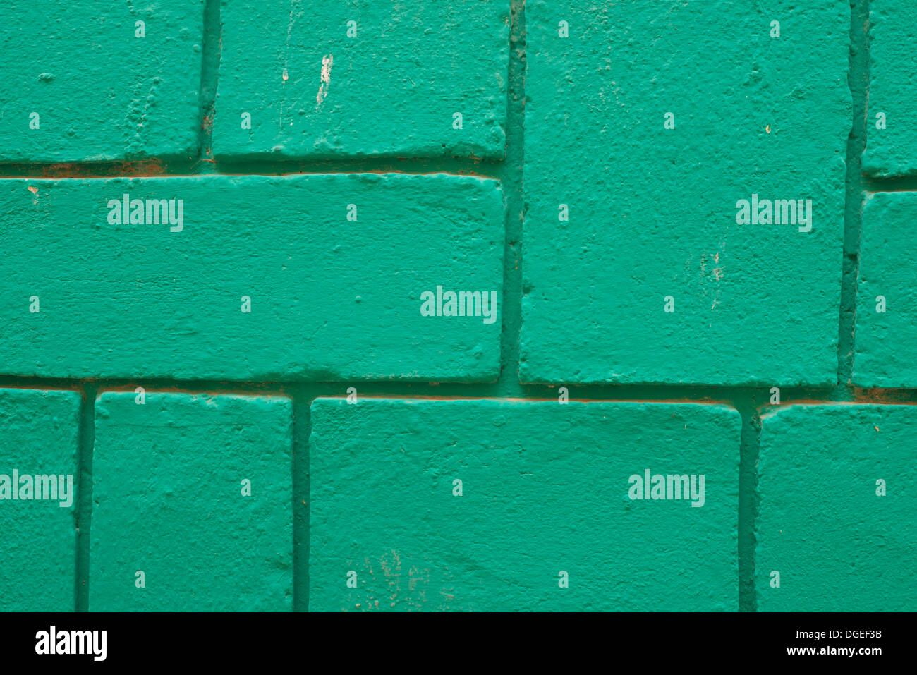 A concrete block wall painted in shiny green Stock Photo - Alamy