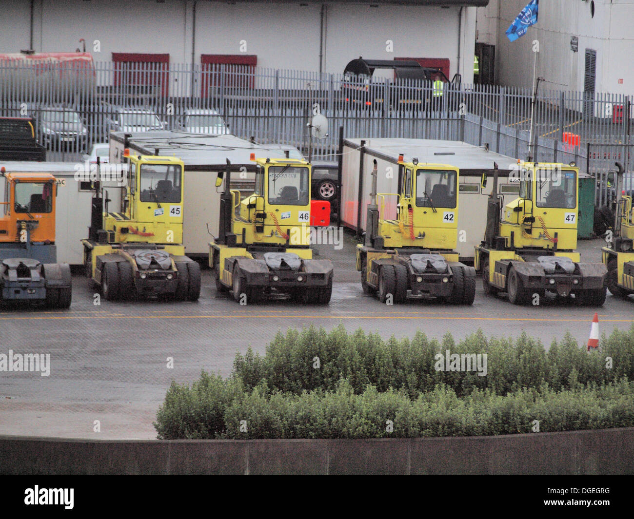 Articulated container port traffic tractors stationary at Dublin port ...
