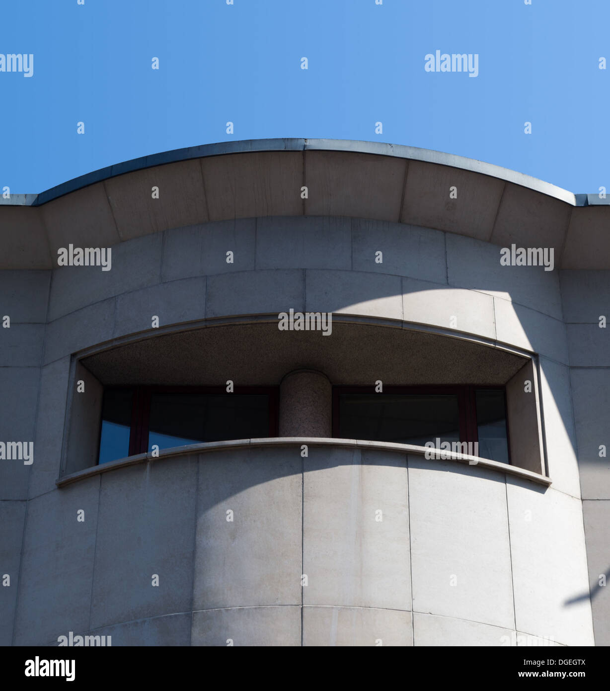A close up of a letterbox style window with imposing shadows across the ...