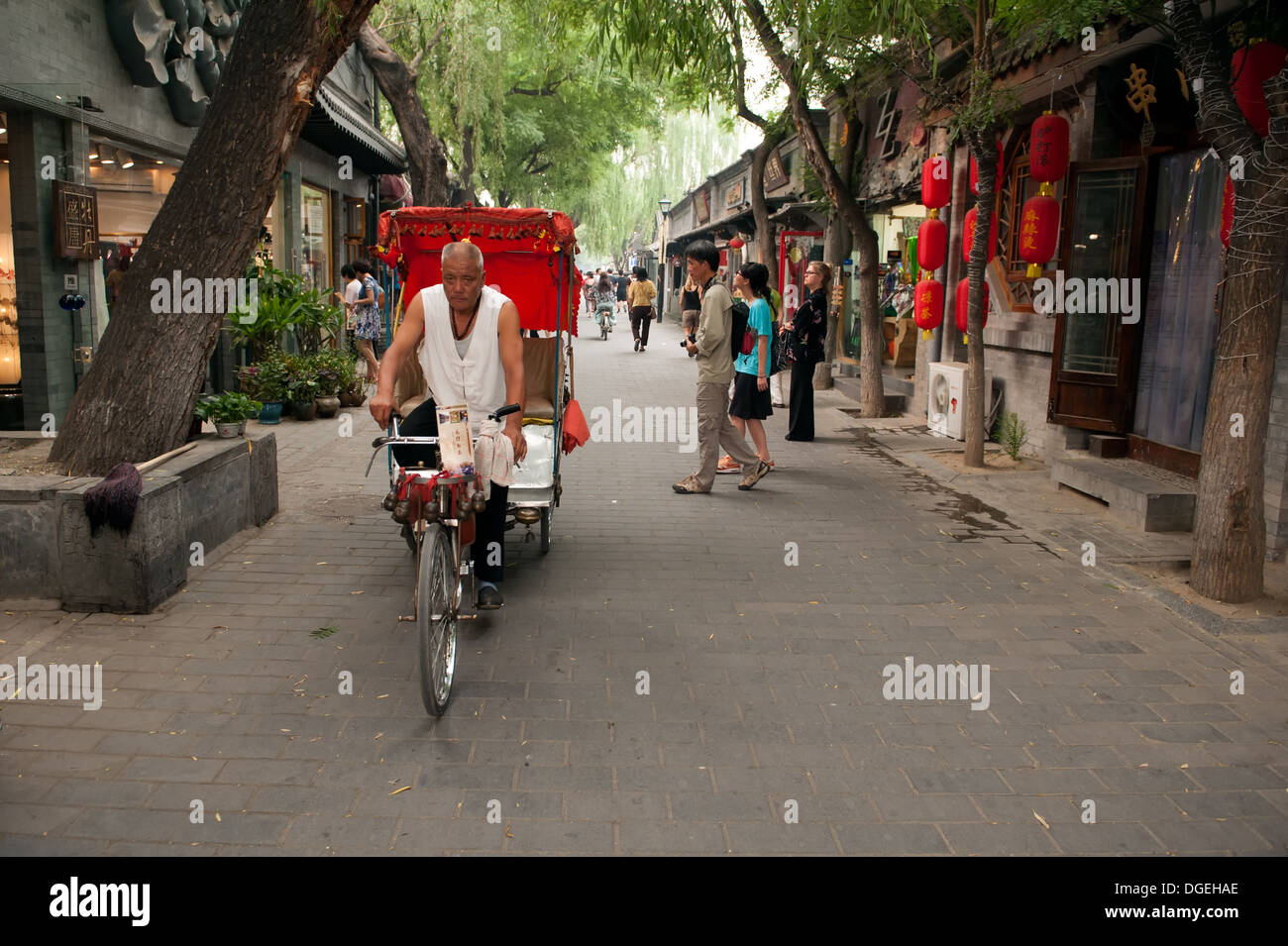 Traditional rickshaw on the main street in the Jing Yang Hutong of ...