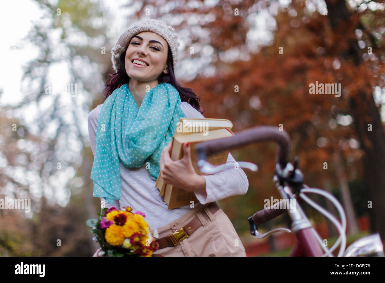 Young woman with a bicycle Stock Photo - Alamy