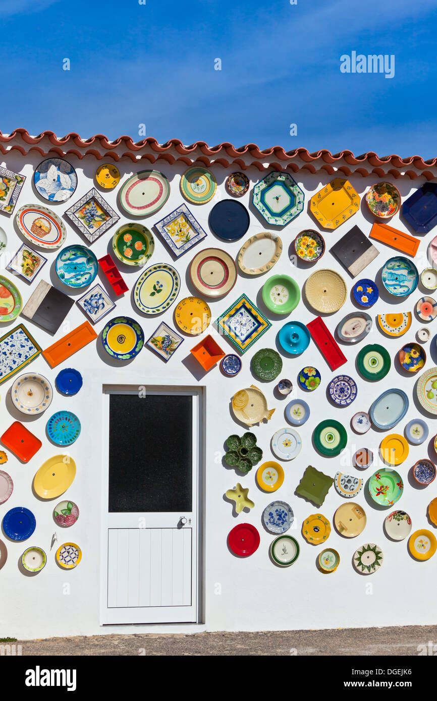Traditional portuguese pottery plates on a wall in Algarve Coast ...