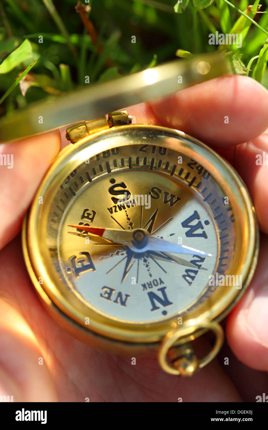 Vintage compass in hand hi-res stock photography and images - Alamy