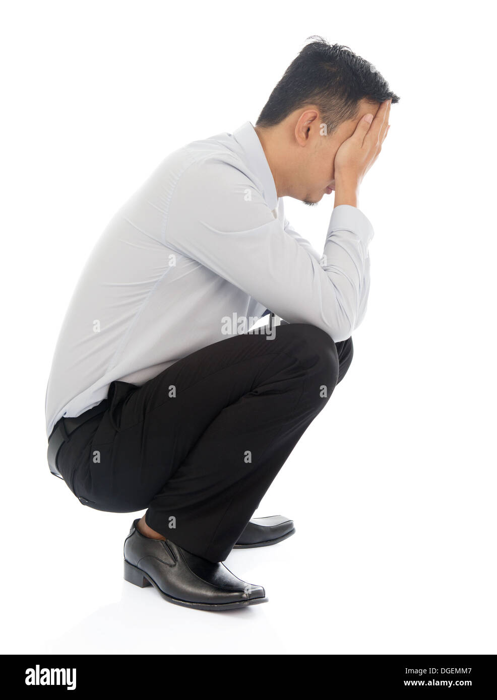 Business man reaction after heard a bad news. Full body squatting ...