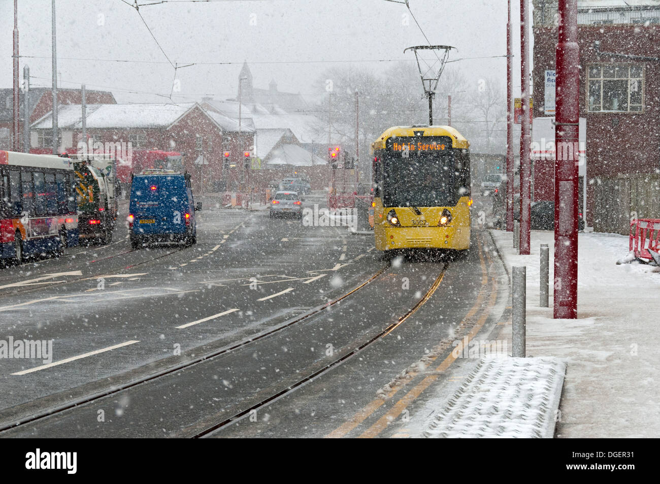 Manchester metrolink tram in snow hi-res stock photography and images ...