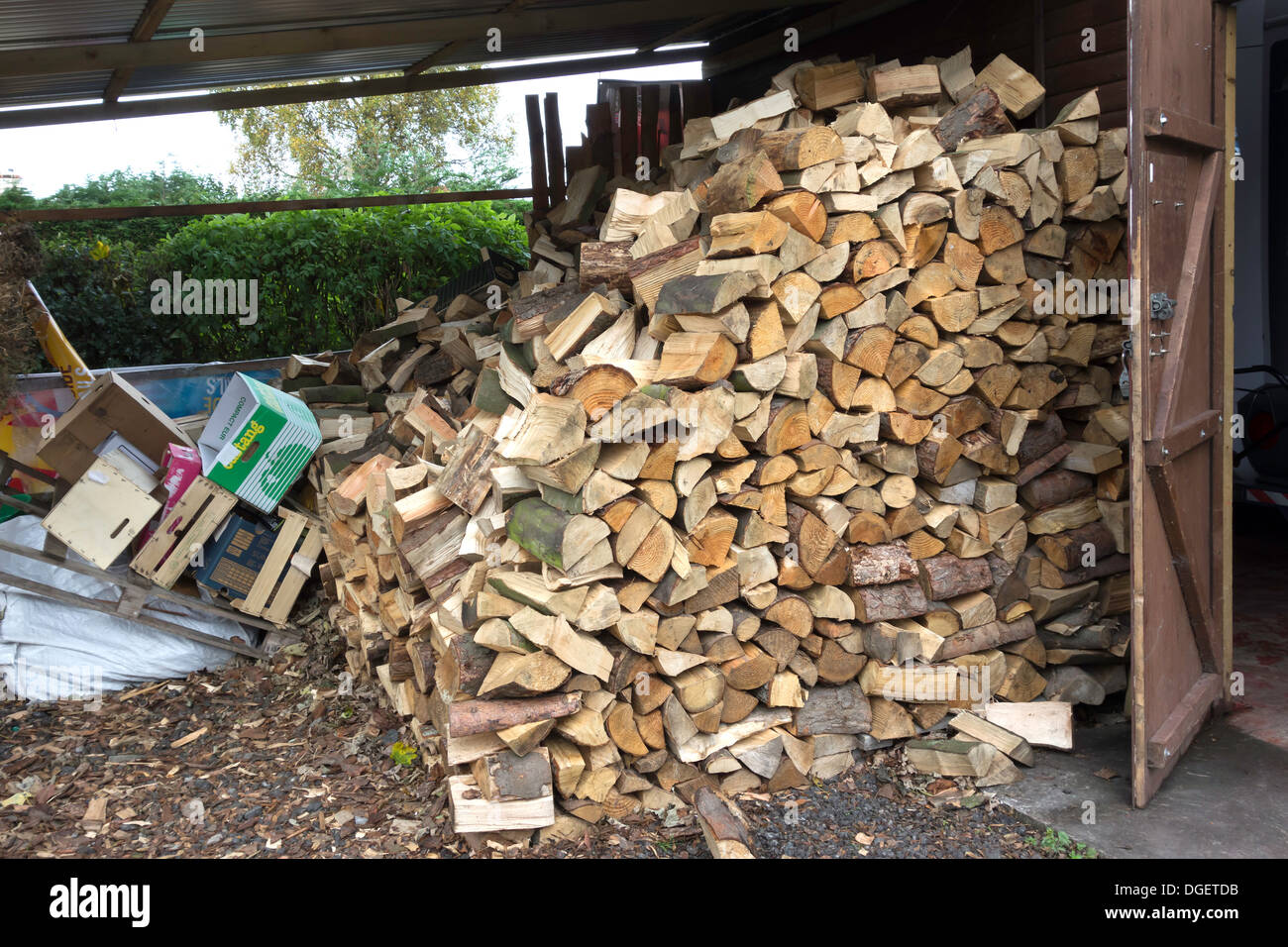 Stack of dry logs for a hotel with several log fires Stock Photo - Alamy