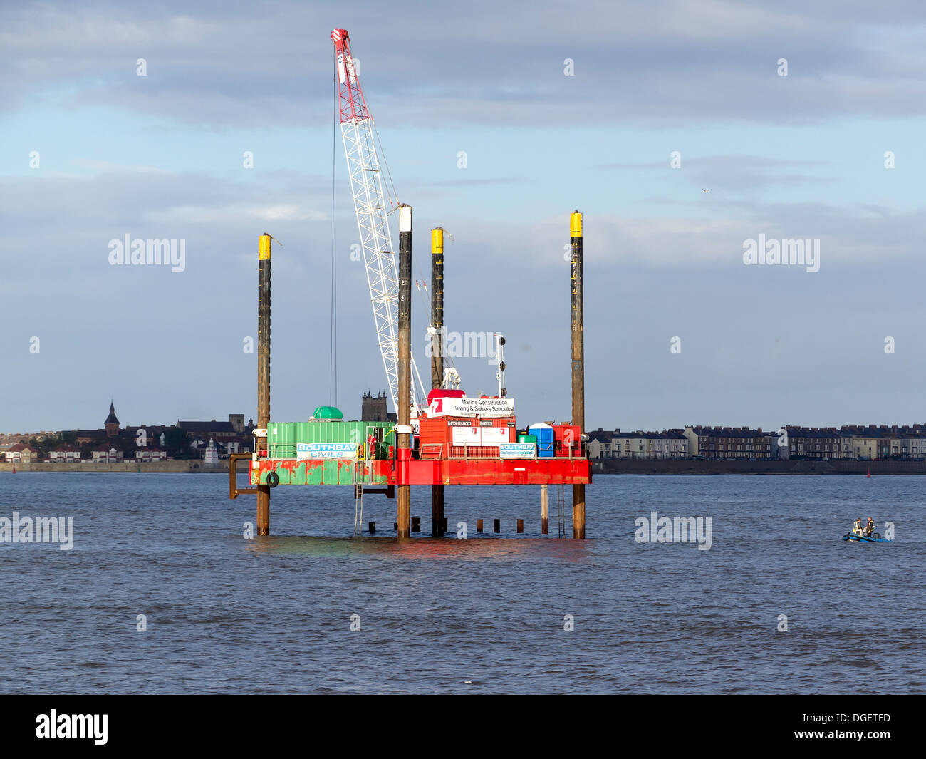 A civil engineering jack-up rig carrying out repairs to a groyne at ...