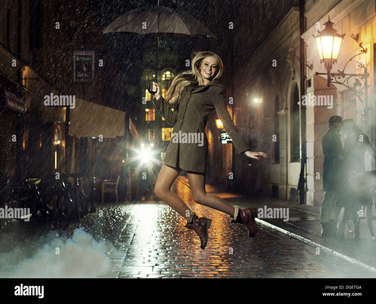 Fantastic photo of attractive lady jumping in heavy rain Stock Photo ...