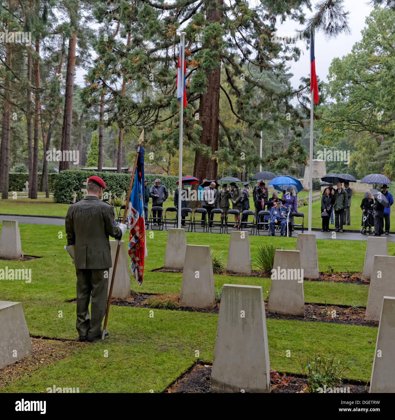 Standard bearer with Colours in the rain as people gather for the ...
