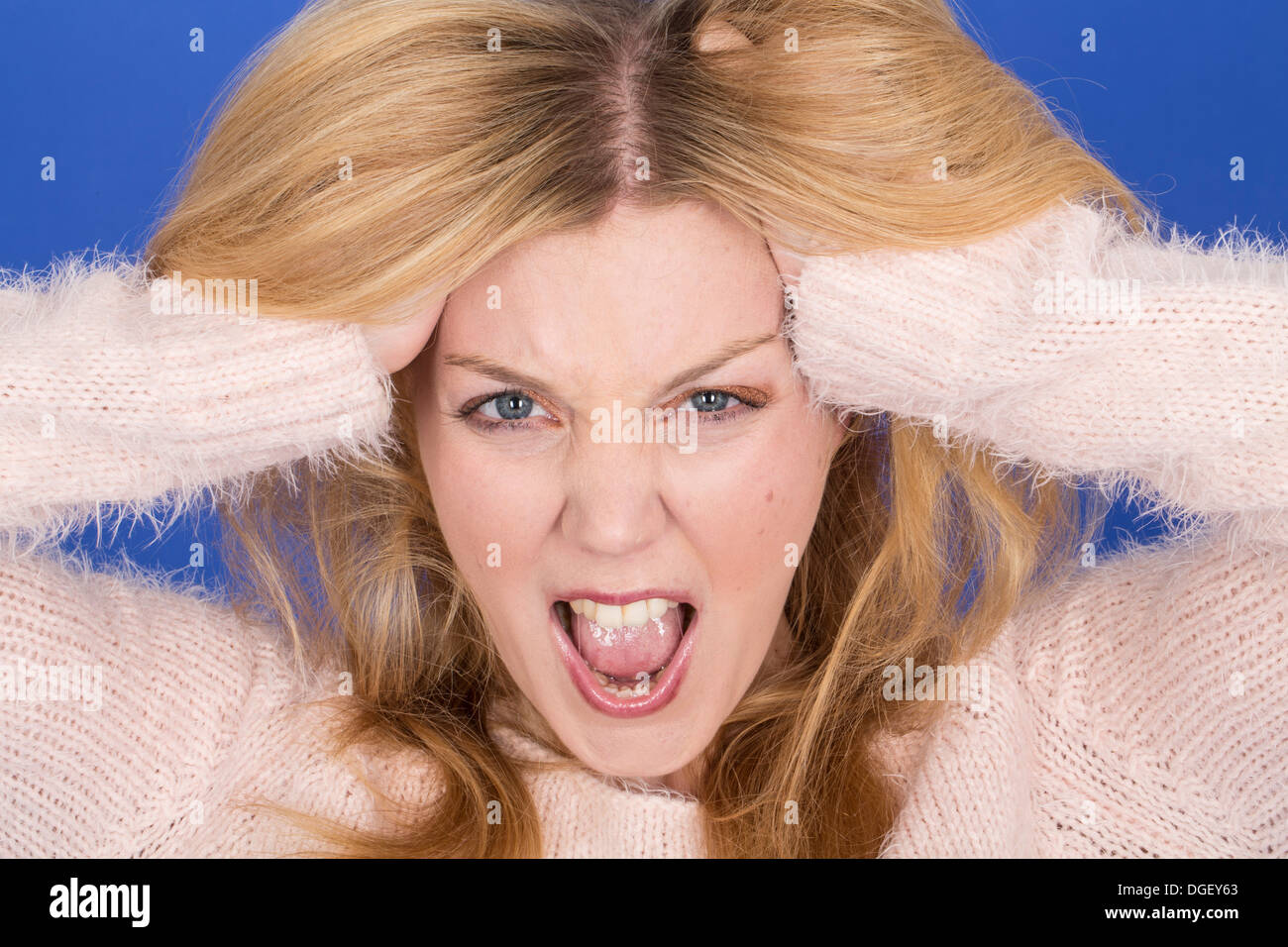 Model Released. Attractive Young Woman Screaming Stock Photo - Alamy