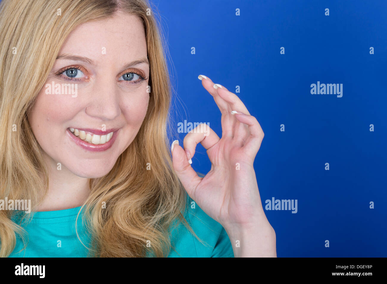 Model Released. Attractive Happy Young Woman OK Sign Stock Photo - Alamy