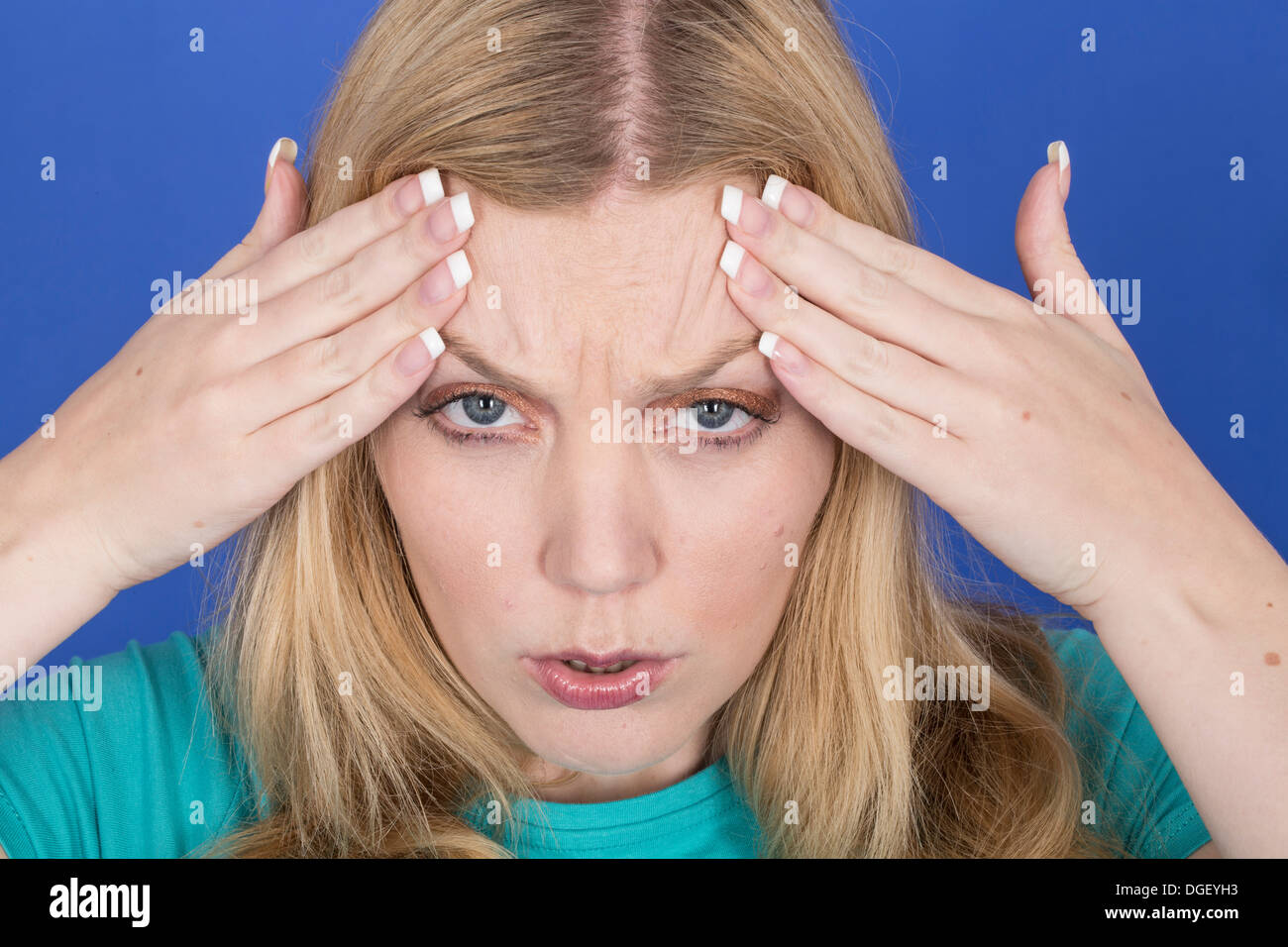 Model Released. Attractive Young Woman with Headache Stock Photo - Alamy